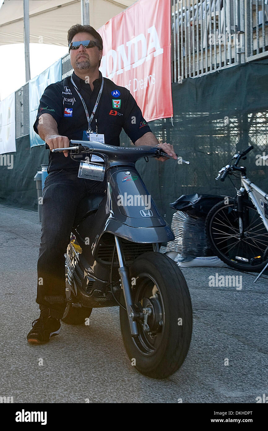 Micheal Andretti on his two wheel scooter heads out of the Pits after ...