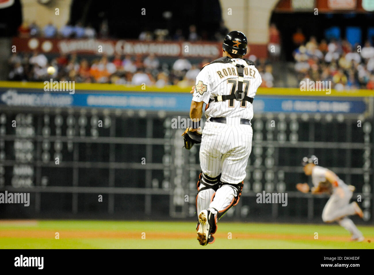 Houston catcher, Ivan Rodriguez, makes a throw to third base for the ...