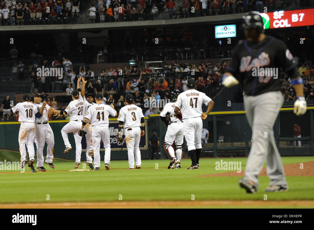 New York left fielder, Fernando Tatis, walks off the field as the ...