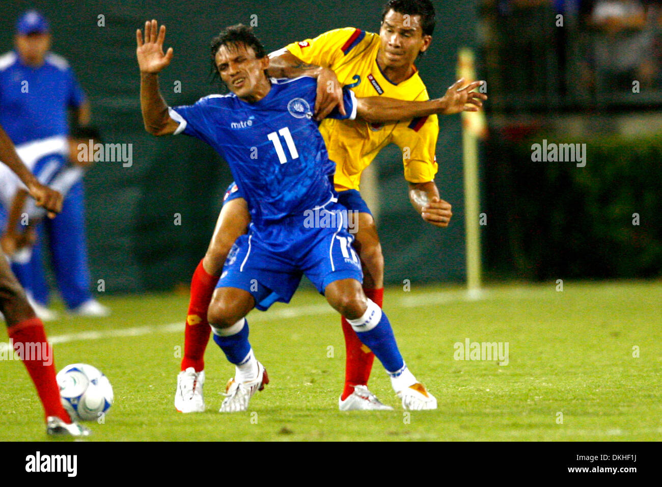 El Salvador midfielder Alexander Rosales (11) is tackled from behind by ...