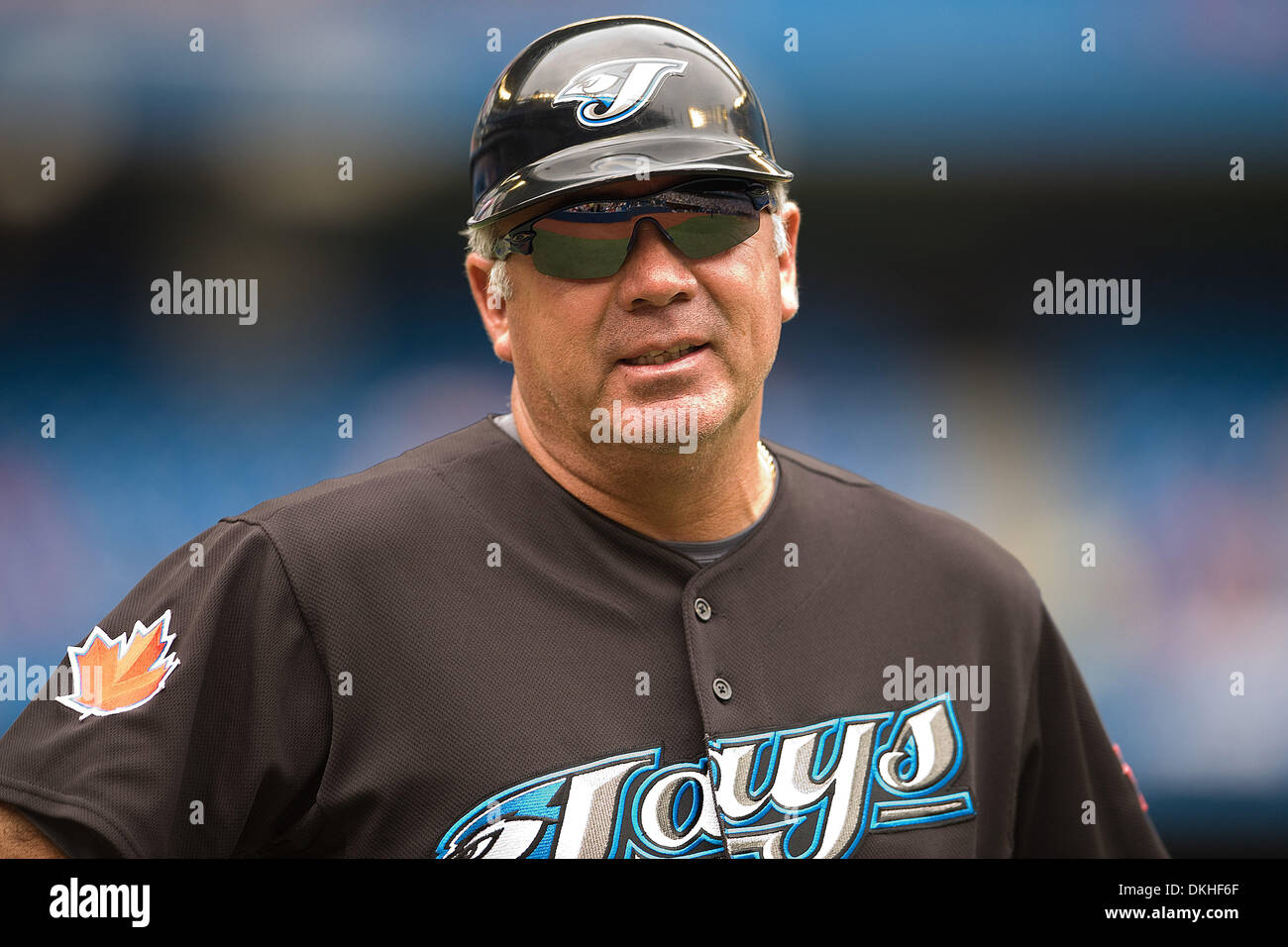 Toronto Blue Jays 3rd base coach Nick Leyva #16 talks with the fans ...