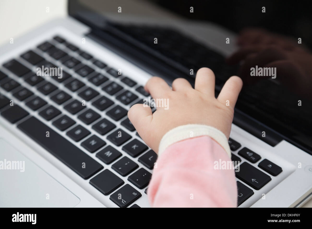 Girl's Hand Typing On Laptop Keyboard Stock Photo - Alamy