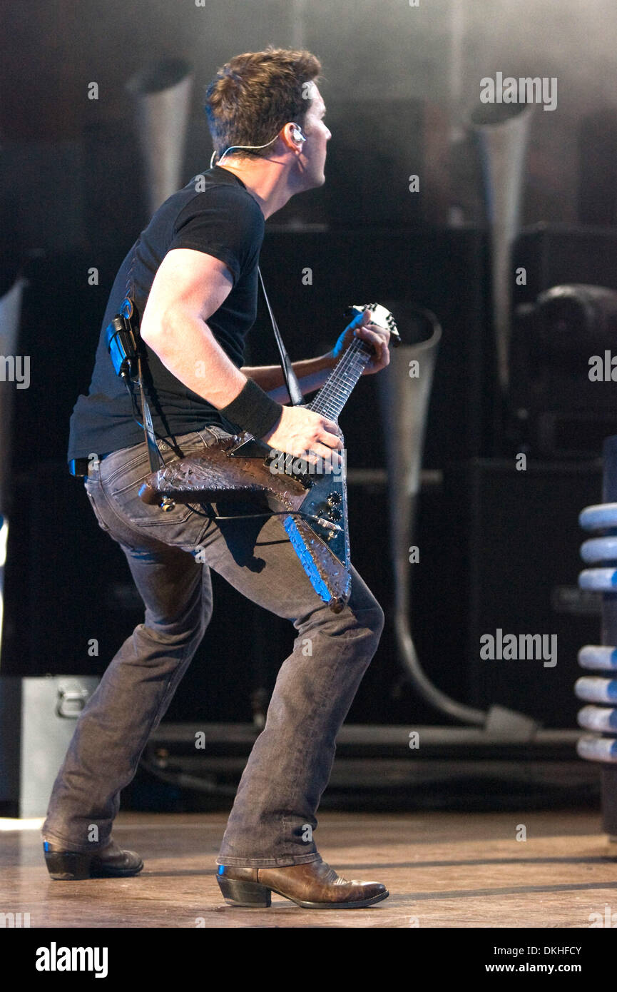 14 August 2009: Nickelback lead guitarist Ryan Peake performs onstage ...