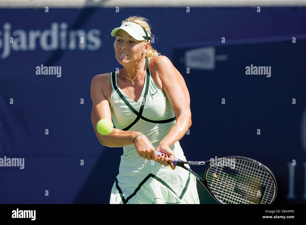 Maria Sharapova of Russia returns a backhand hit to Sybille Bammer of ...