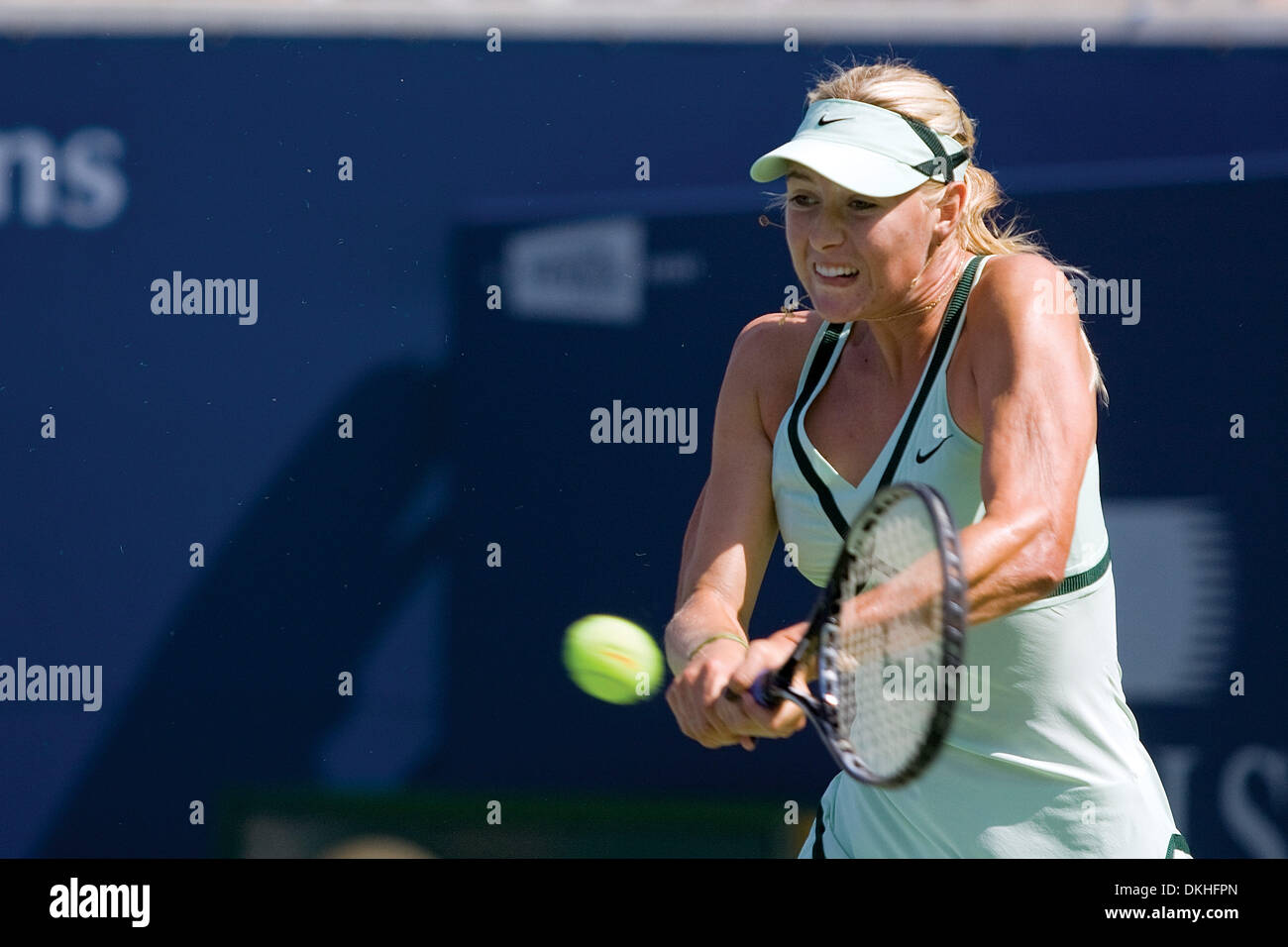 Maria Sharapova of Russia returns a backhand hit to Sybille Bammer of ...