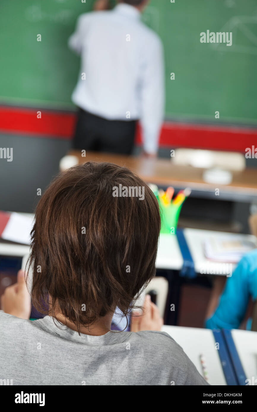 Closeup Of Little Boy Sitting In Classroom Stock Photo - Alamy