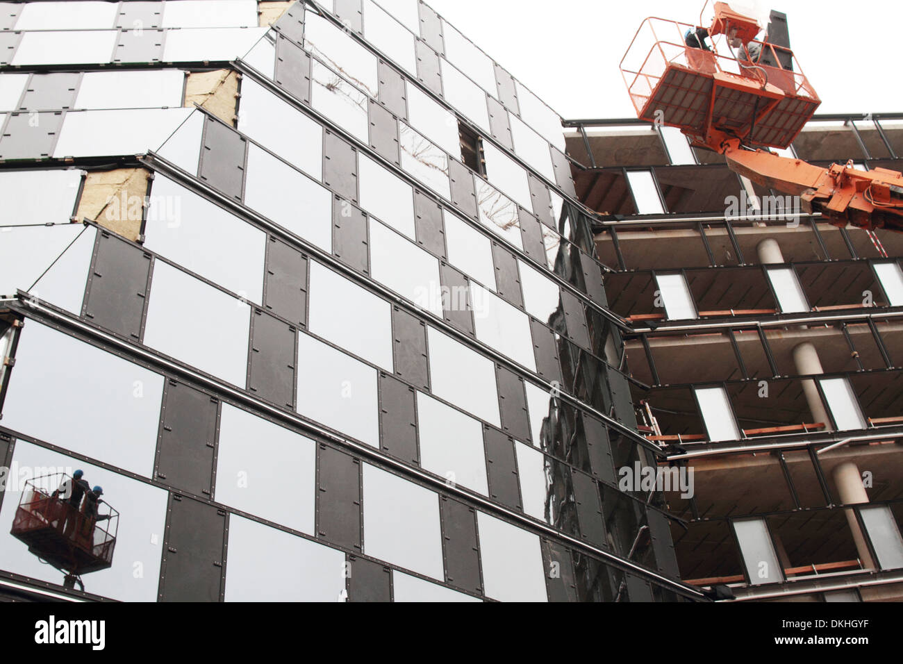 Worker installing windows in building Stock Photo - Alamy