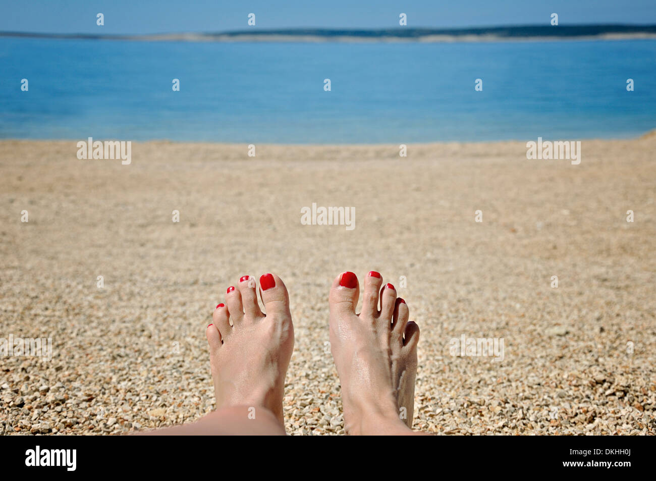 Woman sunbathing at beach hi-res stock photography and images - Alamy
