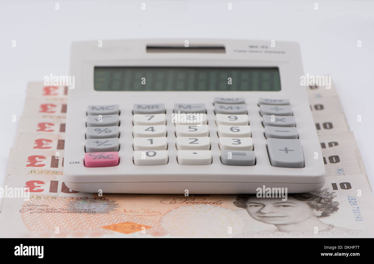 A Calculator On A Pile Of Ten Pound Notes Stock Photo - Alamy