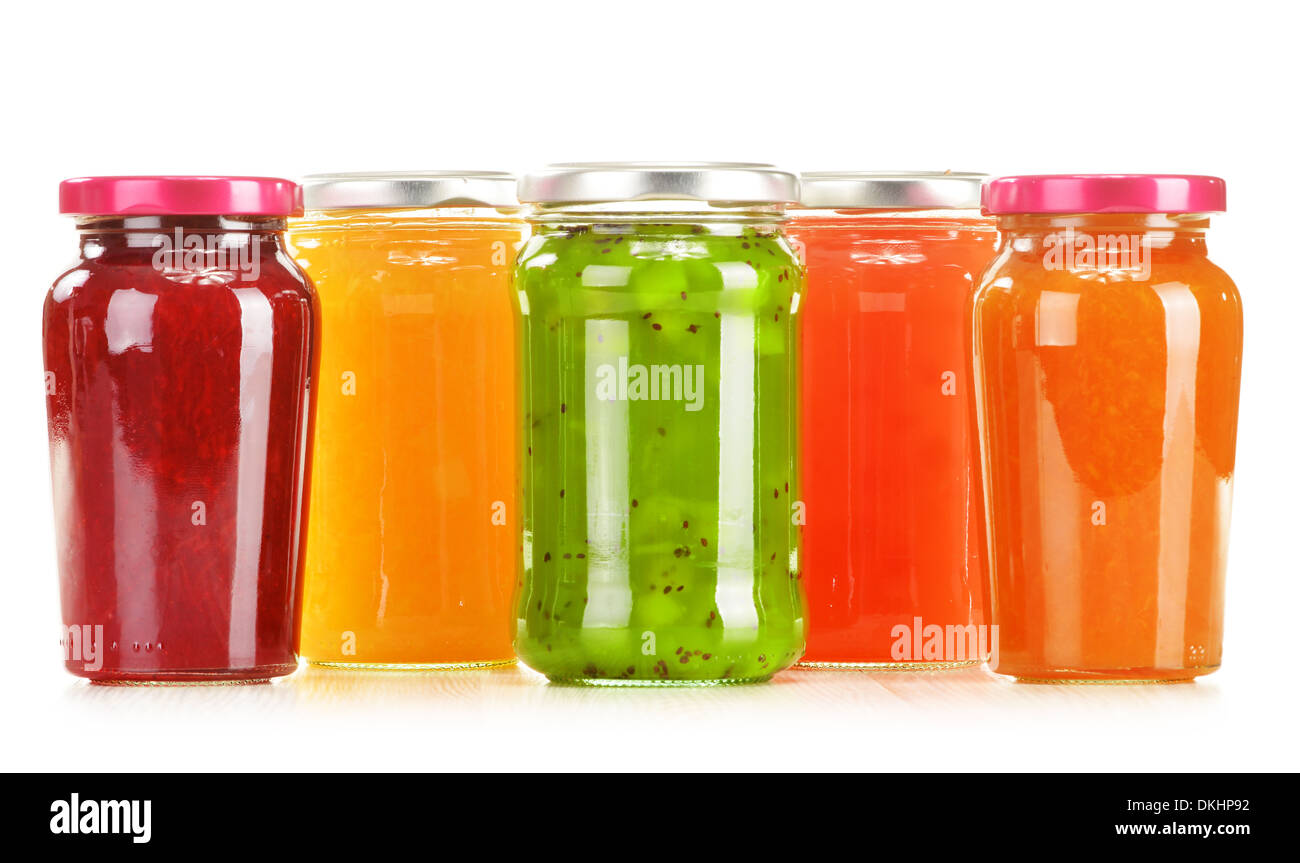 Jars of fruity jams isolated on white background. Preserved fruits ...
