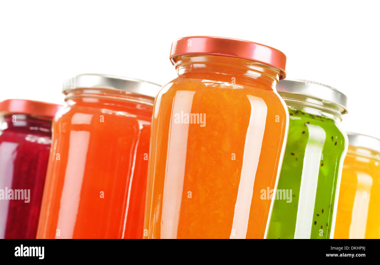 Jars of fruity jams isolated on white background. Preserved fruits ...