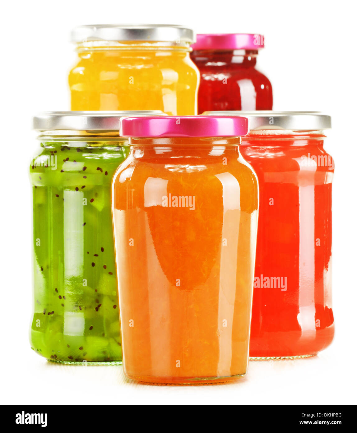 Jars of fruity jams isolated on white background. Preserved fruits ...