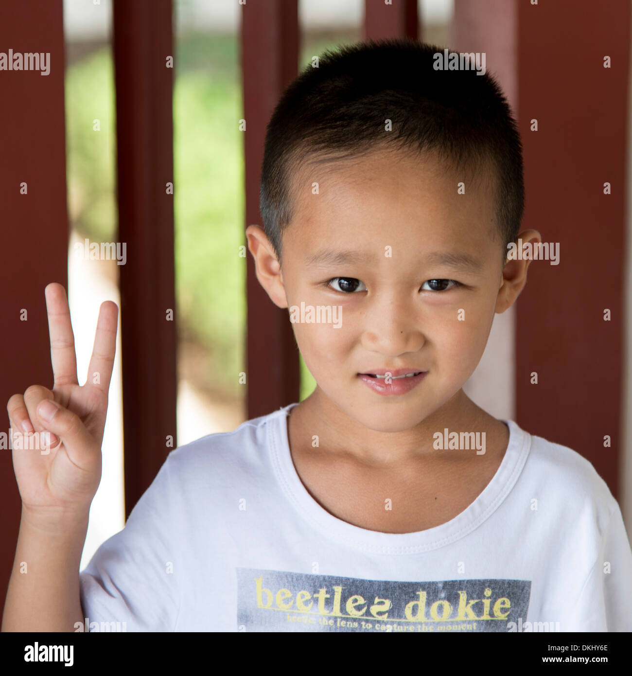 Portrait of a happy little boy gesturing, Xi'an, China Stock Photo - Alamy