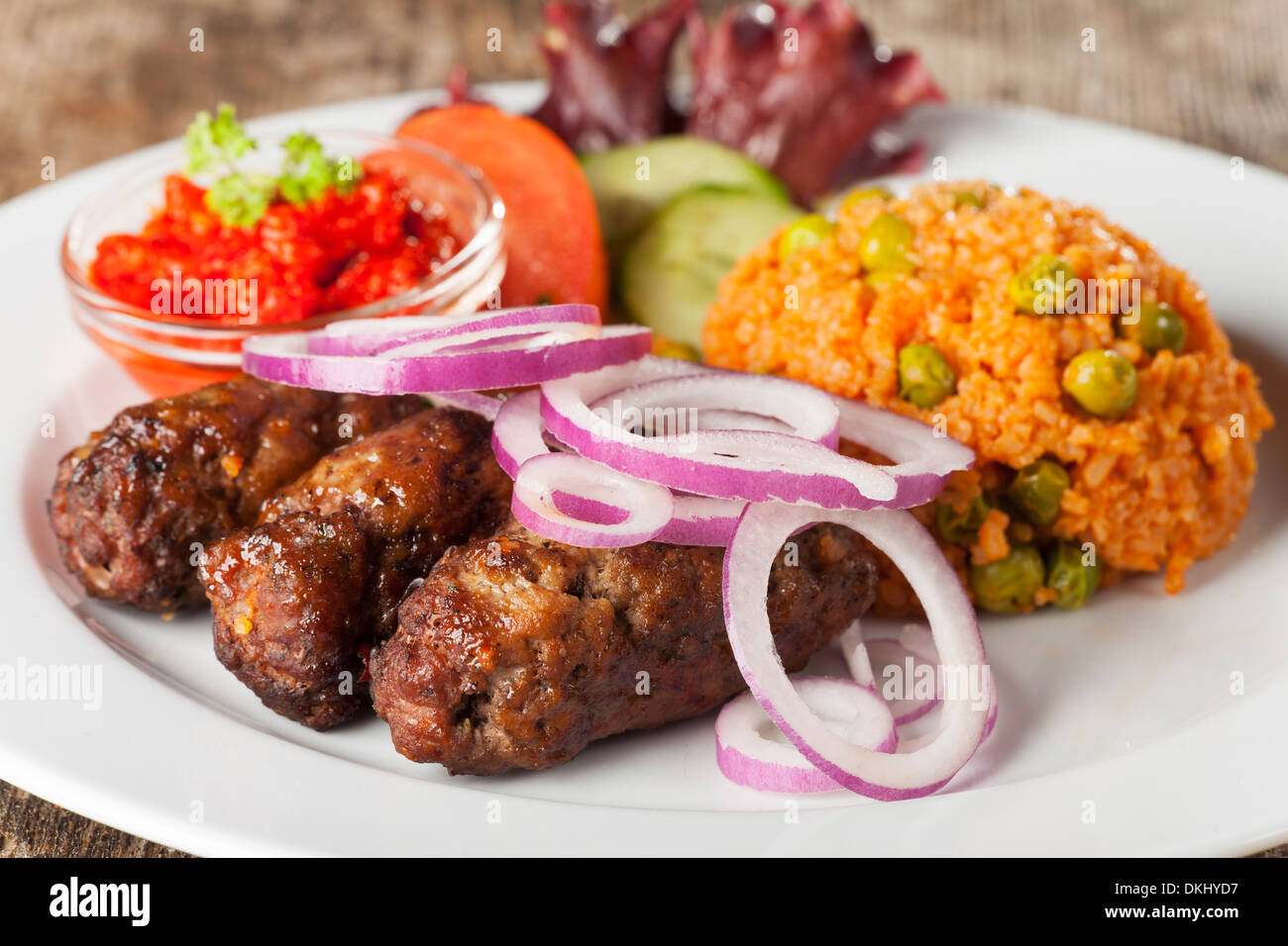cevapcici with rice and salad Stock Photo - Alamy