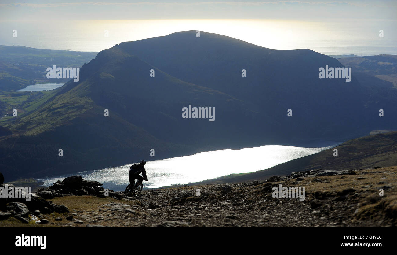 A mountain biker rides down the Rangers Path from the summit of Snowdon ...