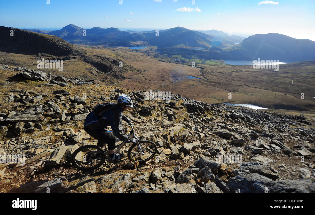 A mountain biker rides down the Rangers Path from the summit of Snowdon ...