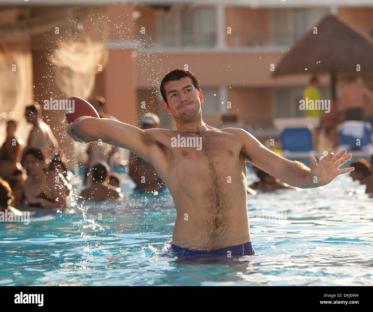 Kentucky basketball player Josh Harrellson threw the football as the ...