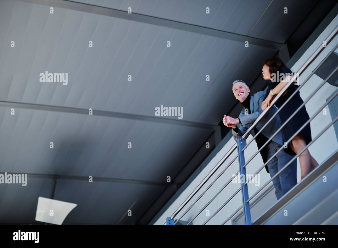 Businessman laughing office railing hi-res stock photography and images ...
