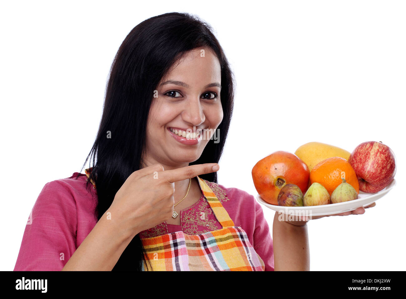 Young happy smiling woman with plate of fruits Stock Photo - Alamy