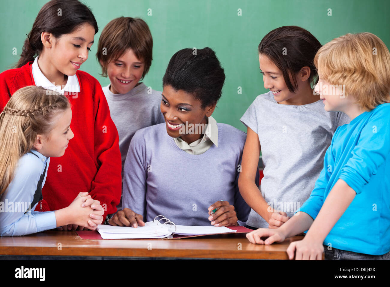 Happy Teacher Teaching Stock Photo - Alamy