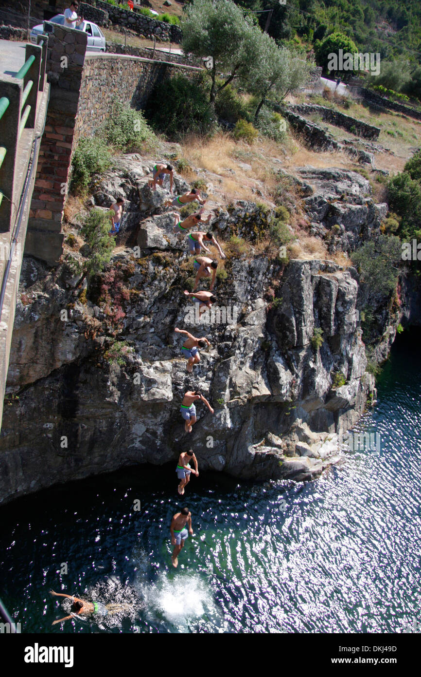 image sequence/ combo: a cliff diver jumps into the river in the Fango ...