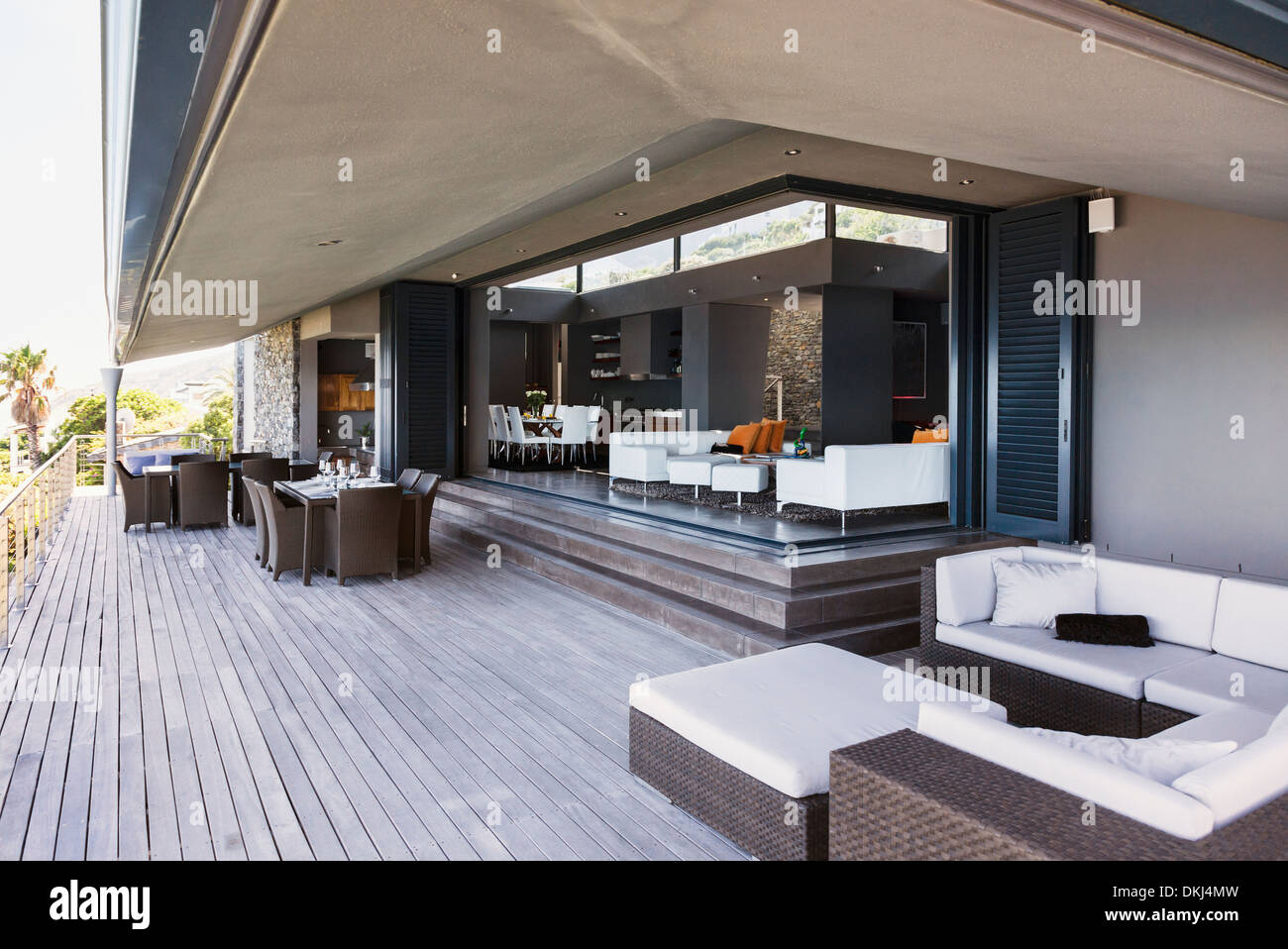 Sofa, tables and chairs on modern balcony Stock Photo - Alamy