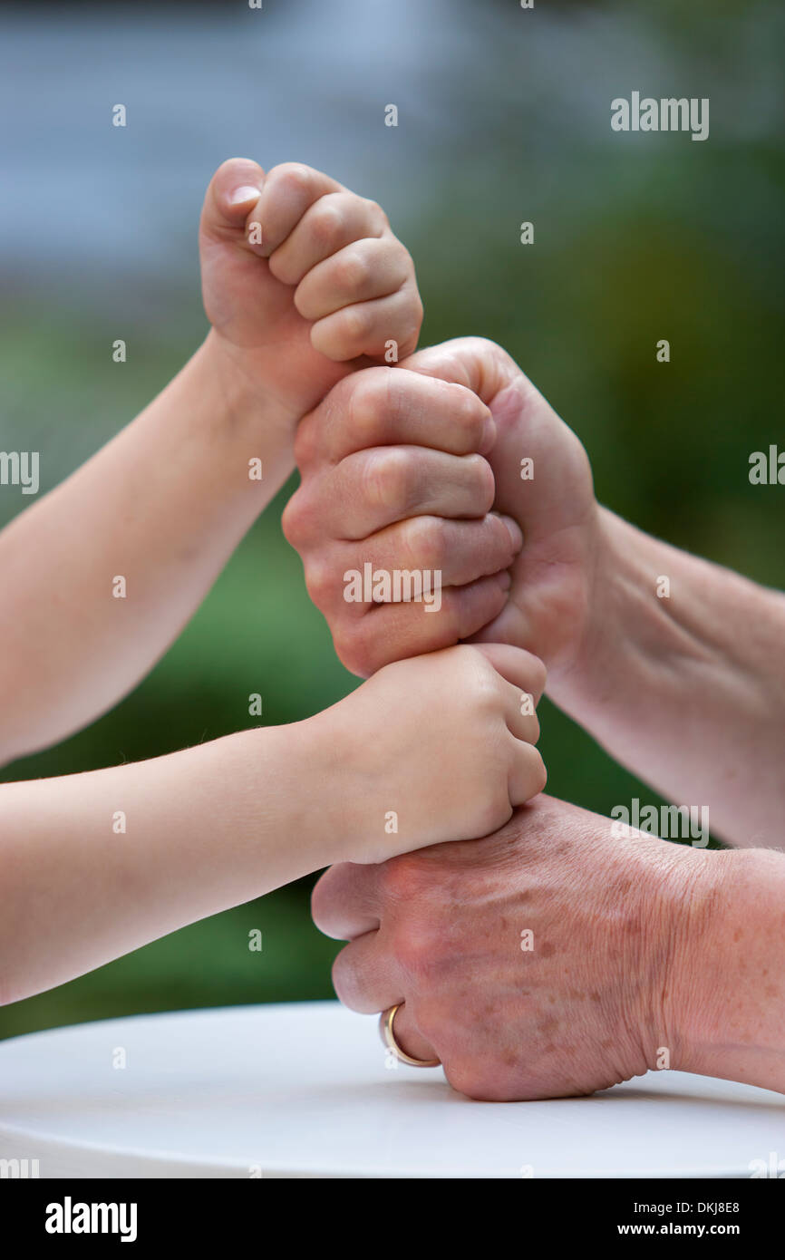 Childrens game with fists Stock Photo - Alamy