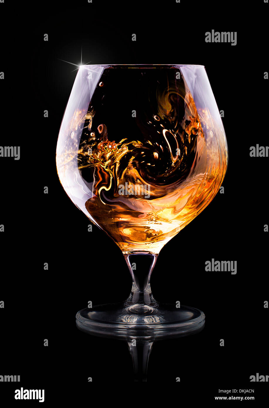 Cognac or brandy on a black background Stock Photo - Alamy