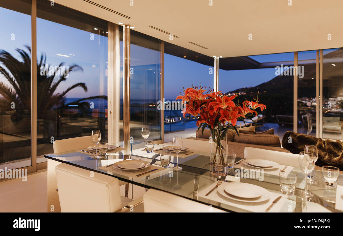 Set table in modern dining room Stock Photo - Alamy