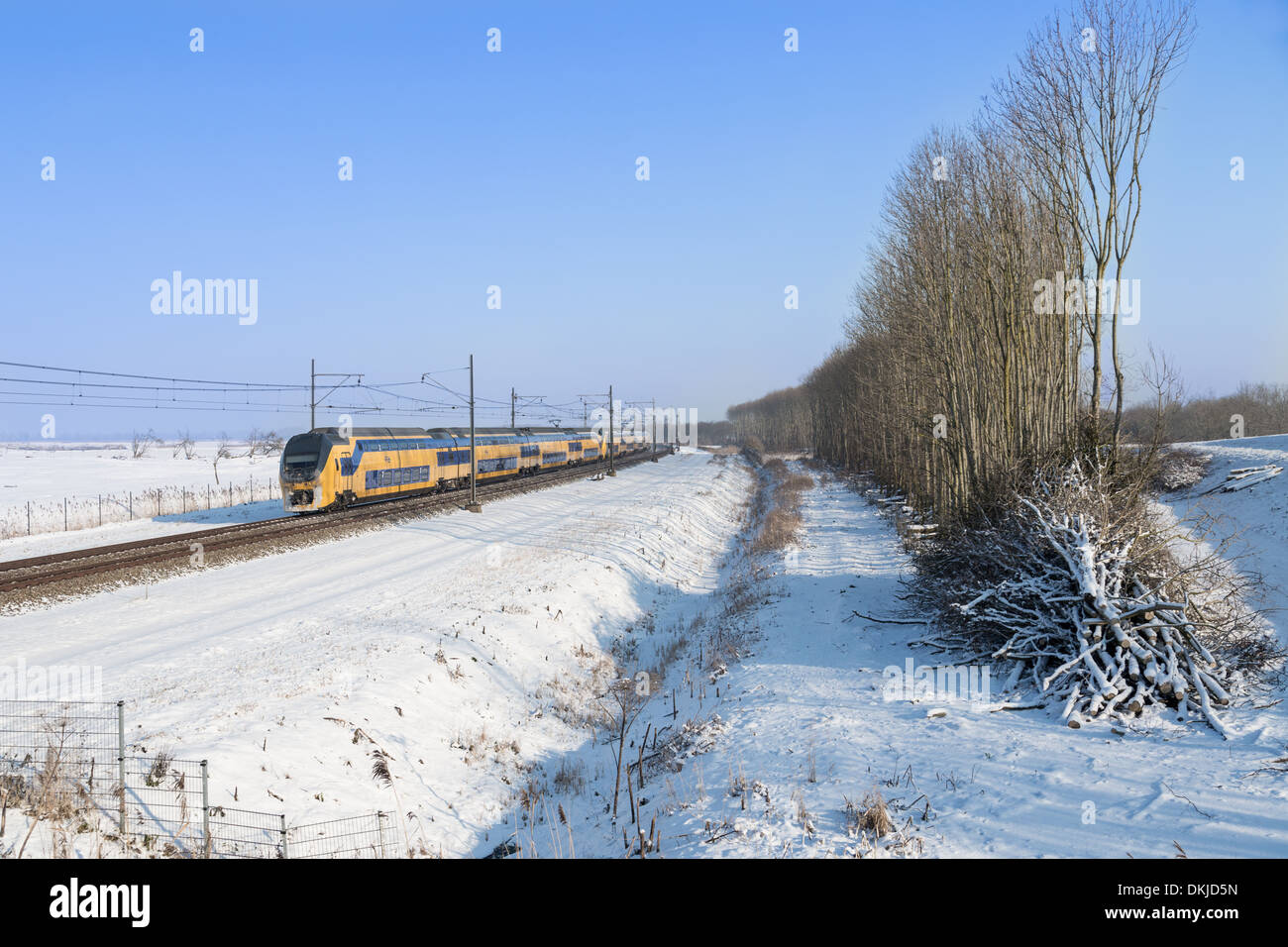 Dutch train in snowy winter landscape Stock Photo - Alamy