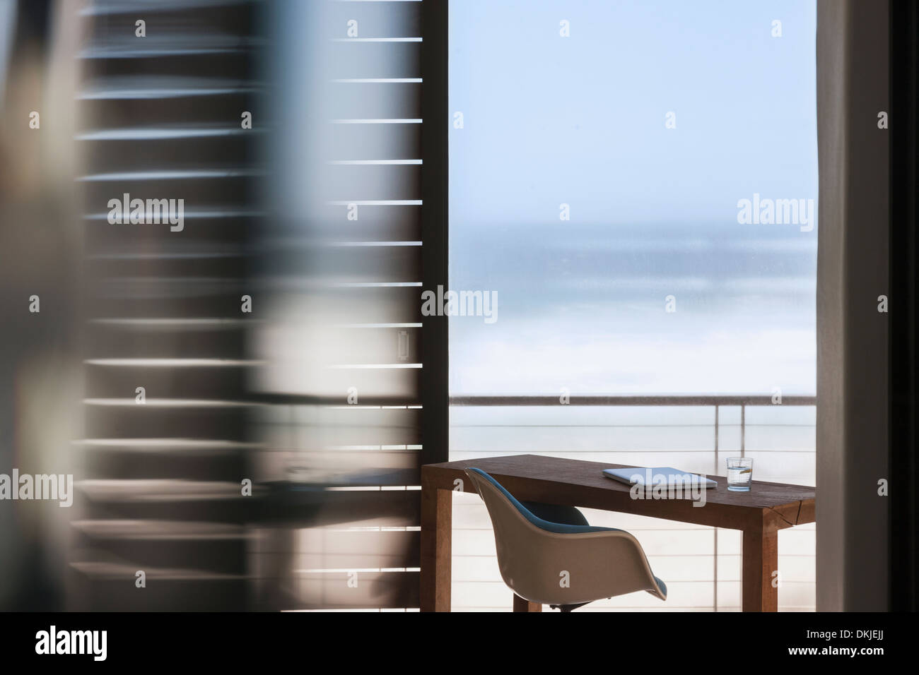 Desk on patio overlooking ocean Stock Photo - Alamy