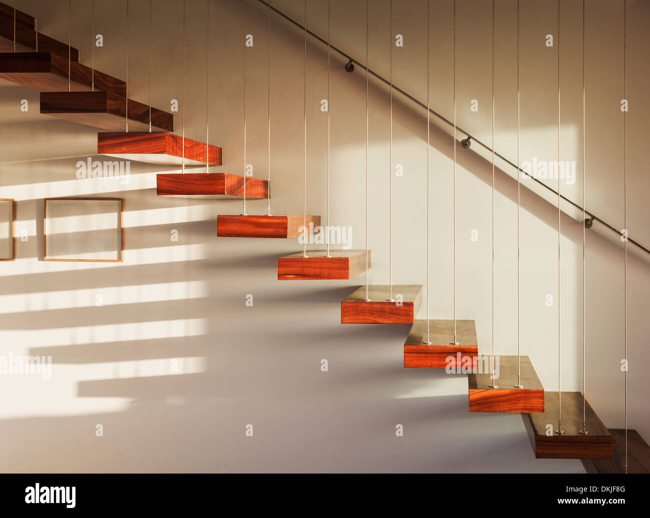 Shadows on floating staircase in modern house Stock Photo - Alamy