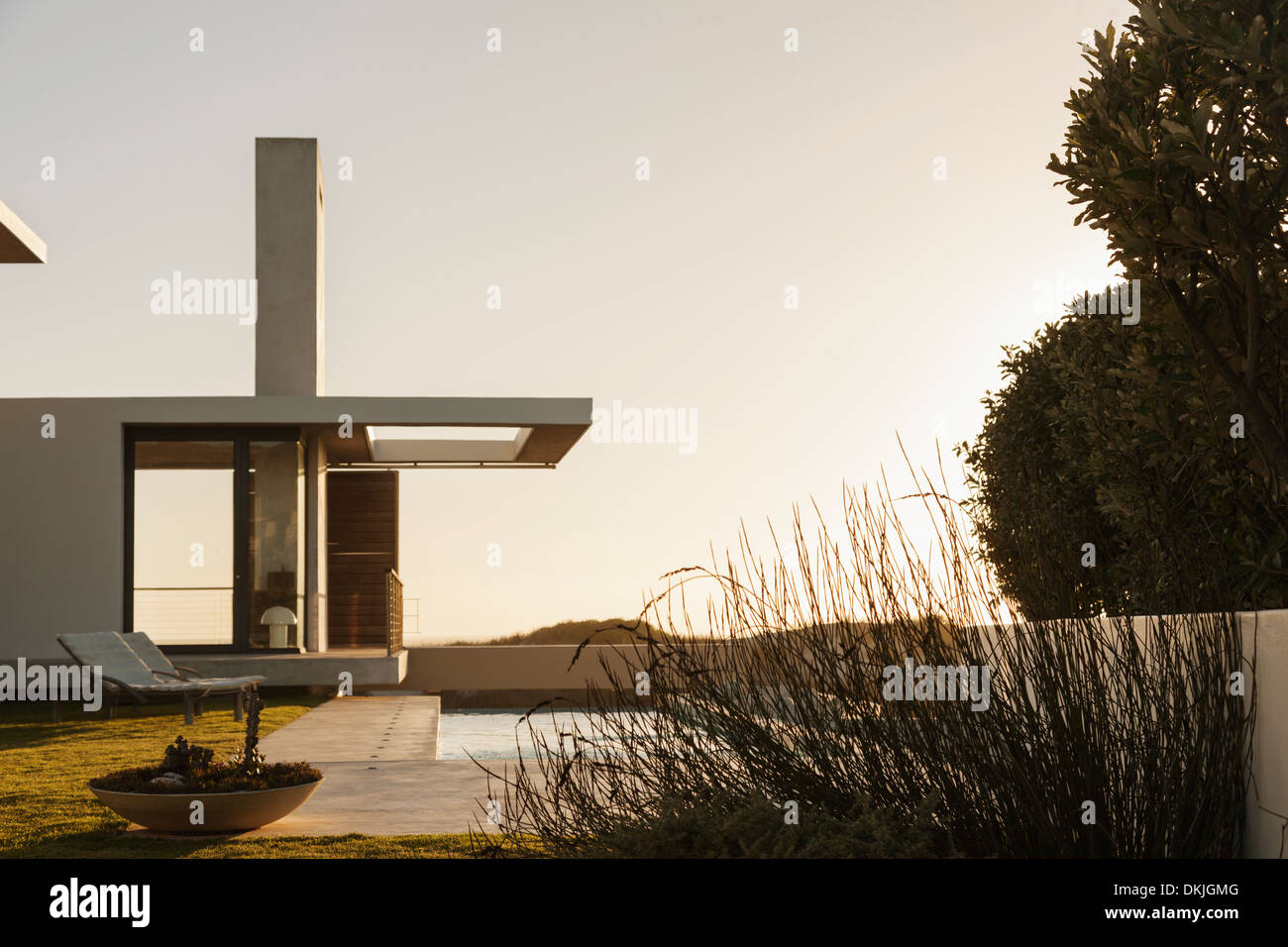 Lap pool along modern house at sunset Stock Photo - Alamy