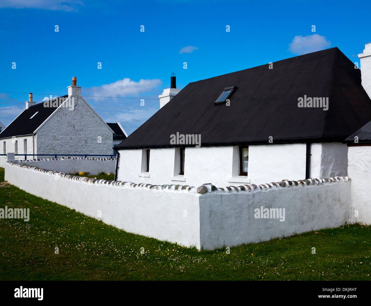 Traditional white painted crofters cottages at Mannal on the Isle of ...