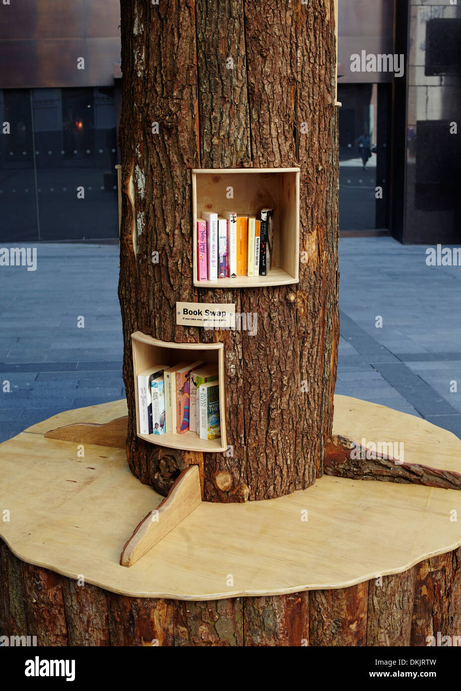 book swap tree in shopping centre Stock Photo - Alamy