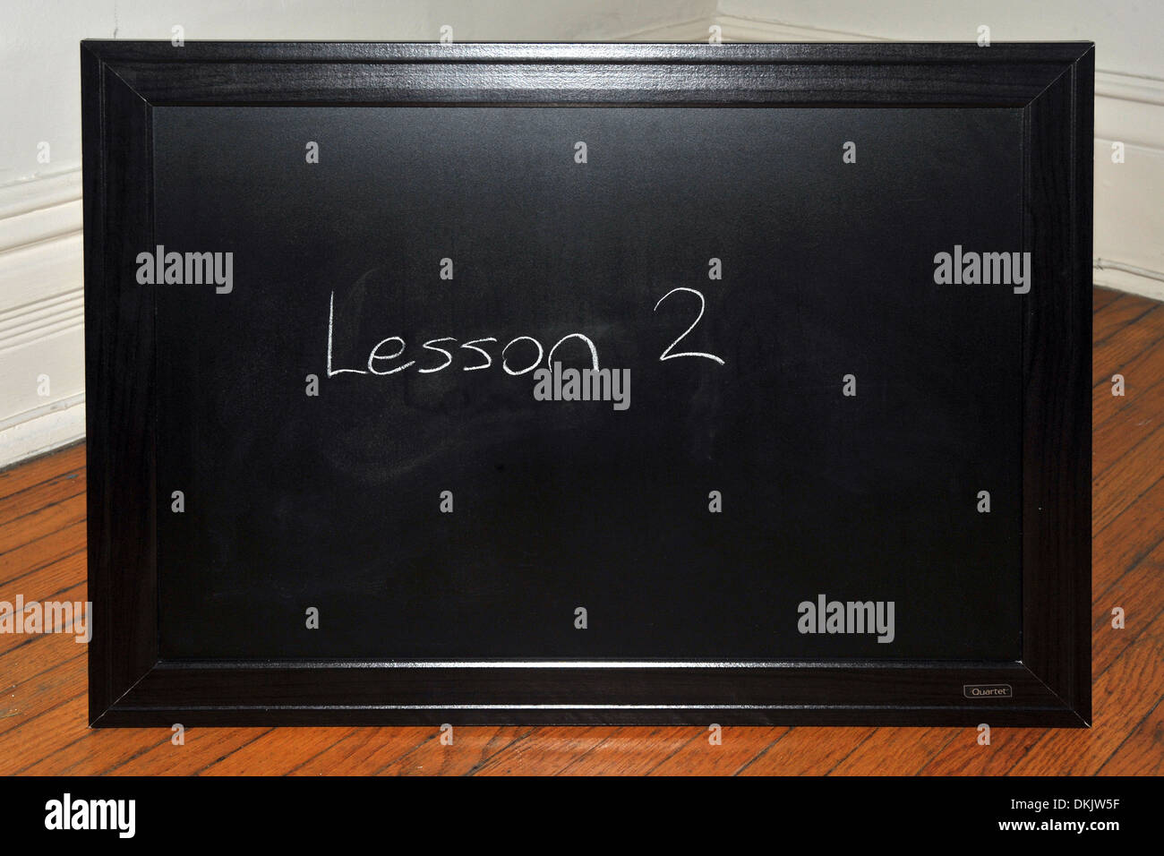 A blackboard with the word lesson 2 written on it in white chalk Stock ...