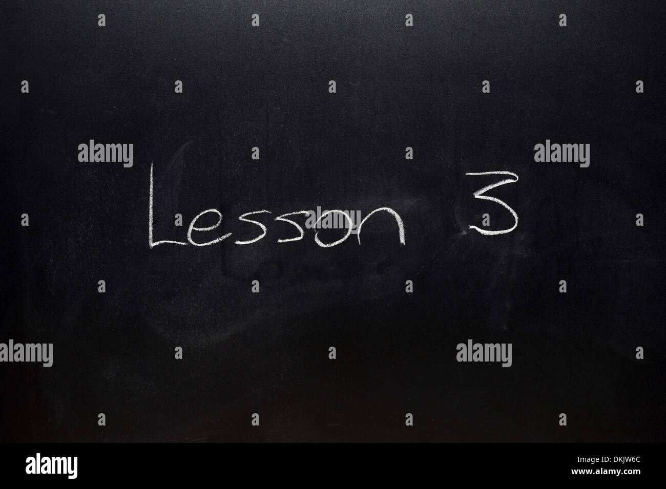A blackboard with the word lesson 3 written on it in white chalk Stock ...