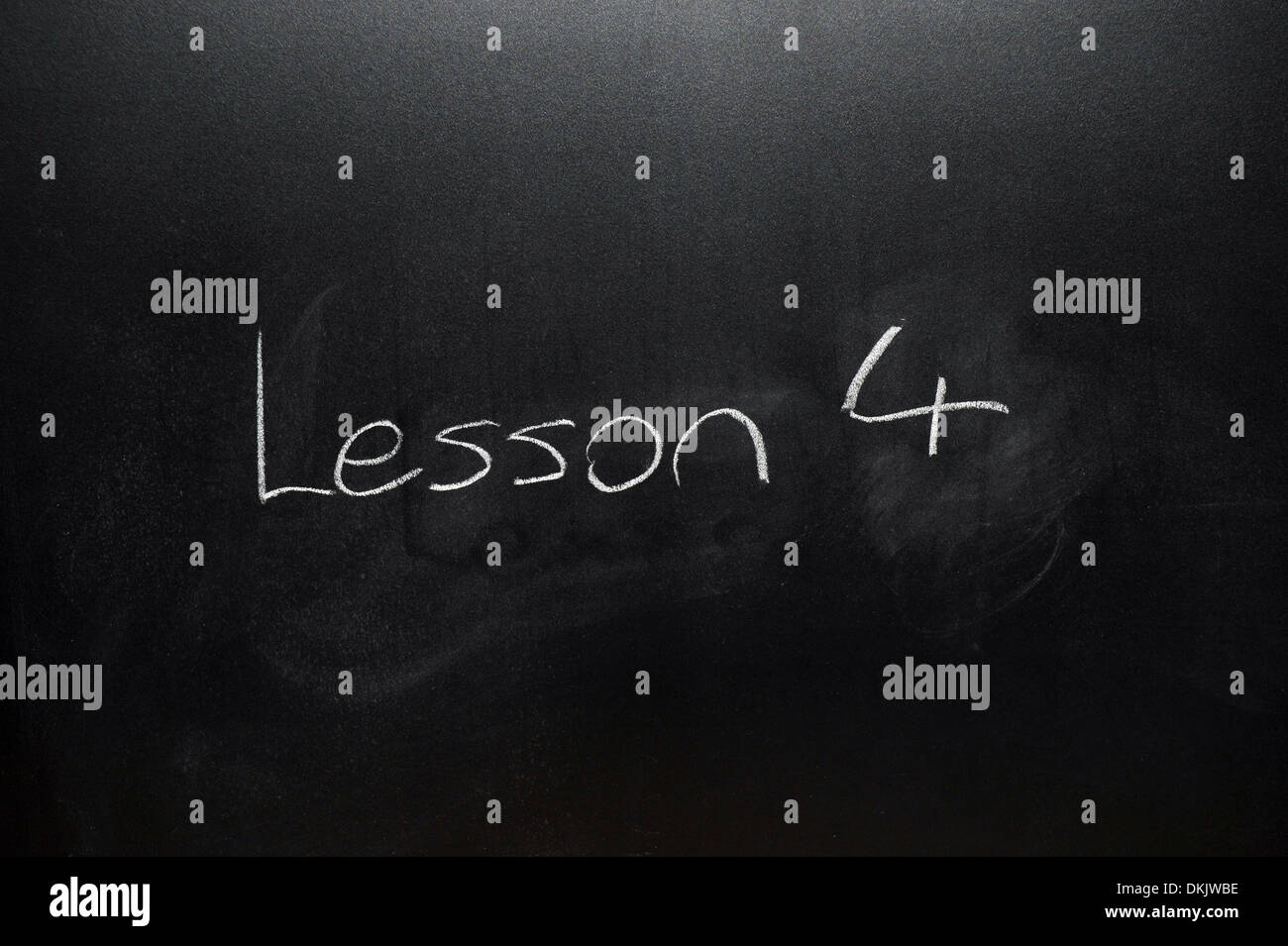 A blackboard with the word lesson 4 written on it in white chalk Stock ...