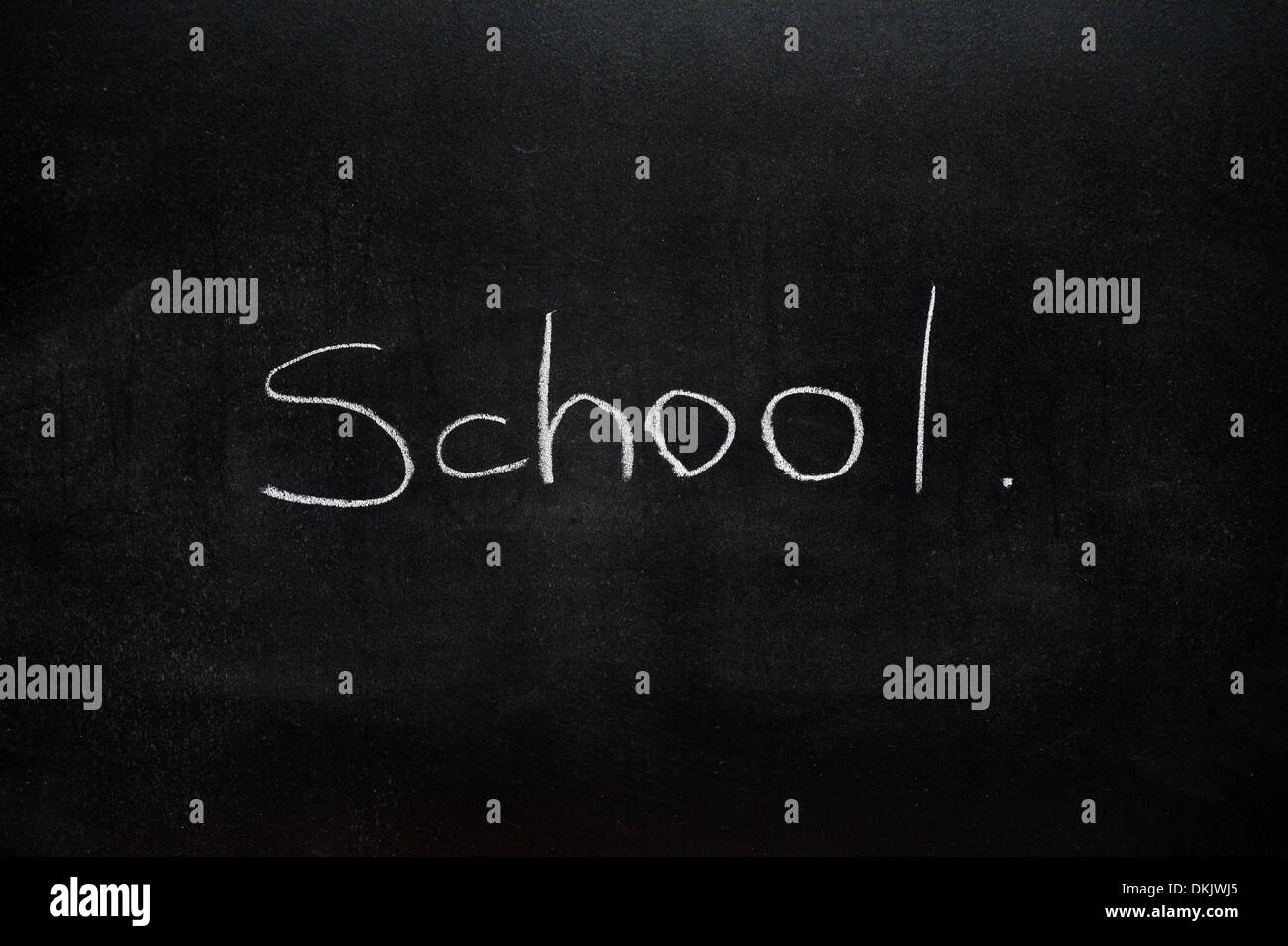 A blackboard with the word School written on it in white chalk Stock ...