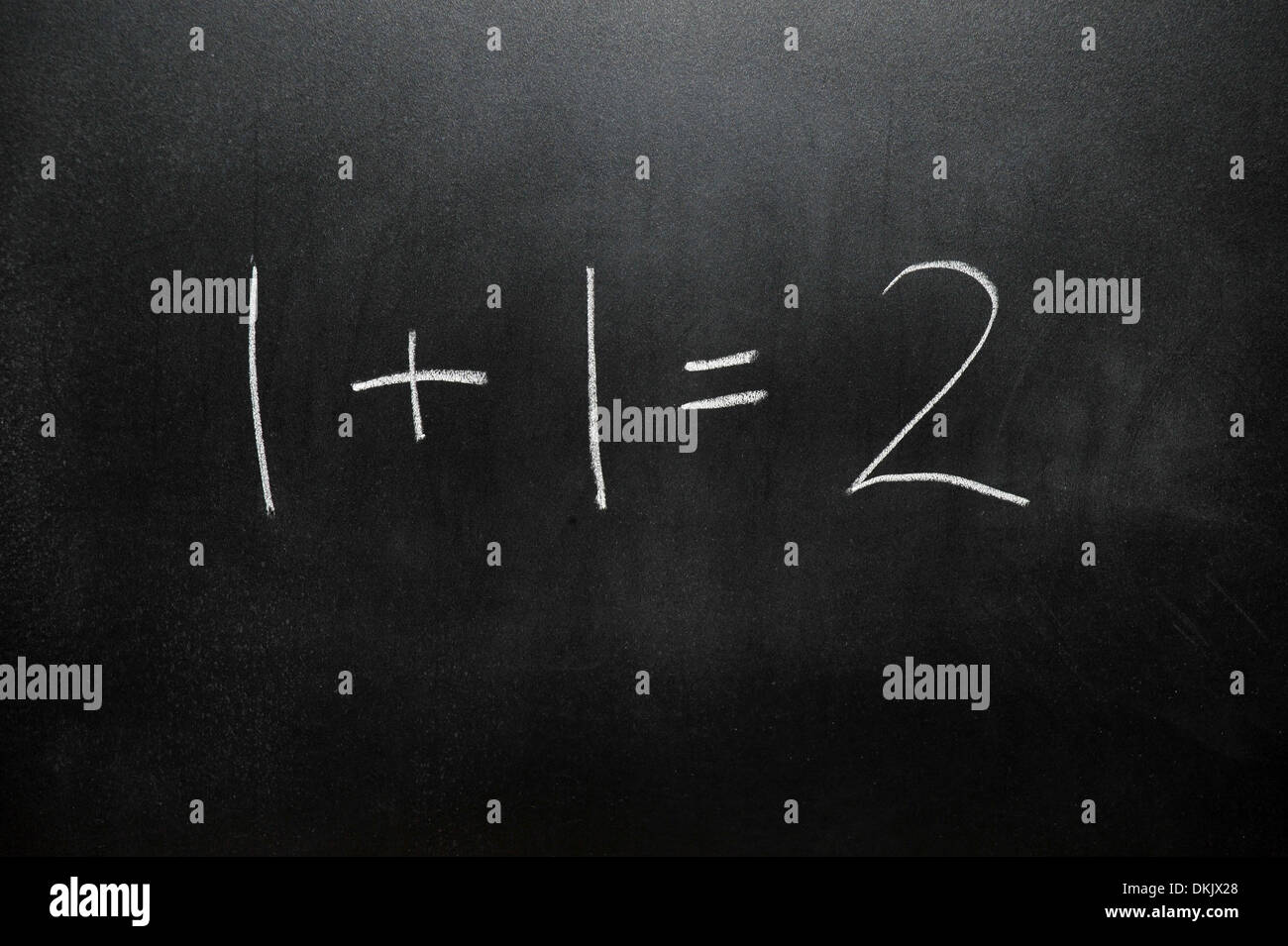 A blackboard with the sum 1+1=2 written on it in white chalk Stock ...