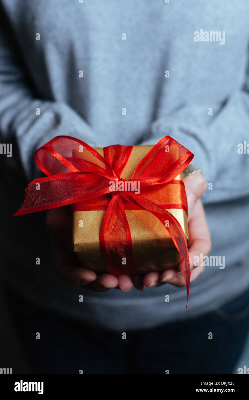 Giving a gift Stock Photo - Alamy