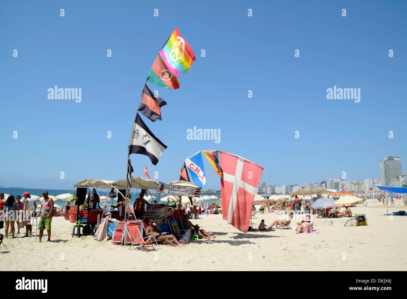 A host of flags at a coconut stall on Copacabana beach in Rio de ...