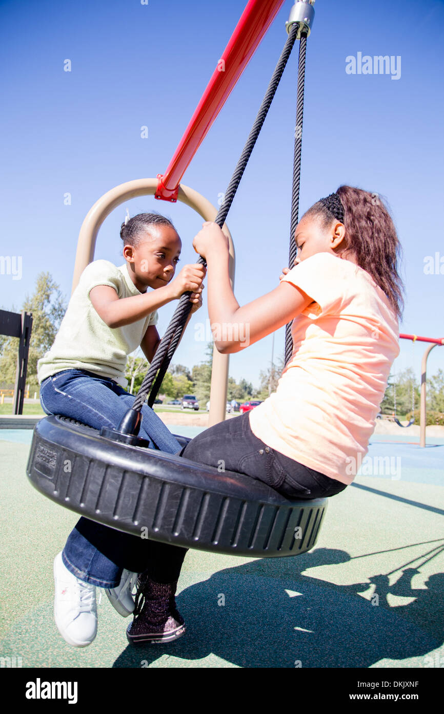 Two girls playing park playground hi-res stock photography and images - Alamy