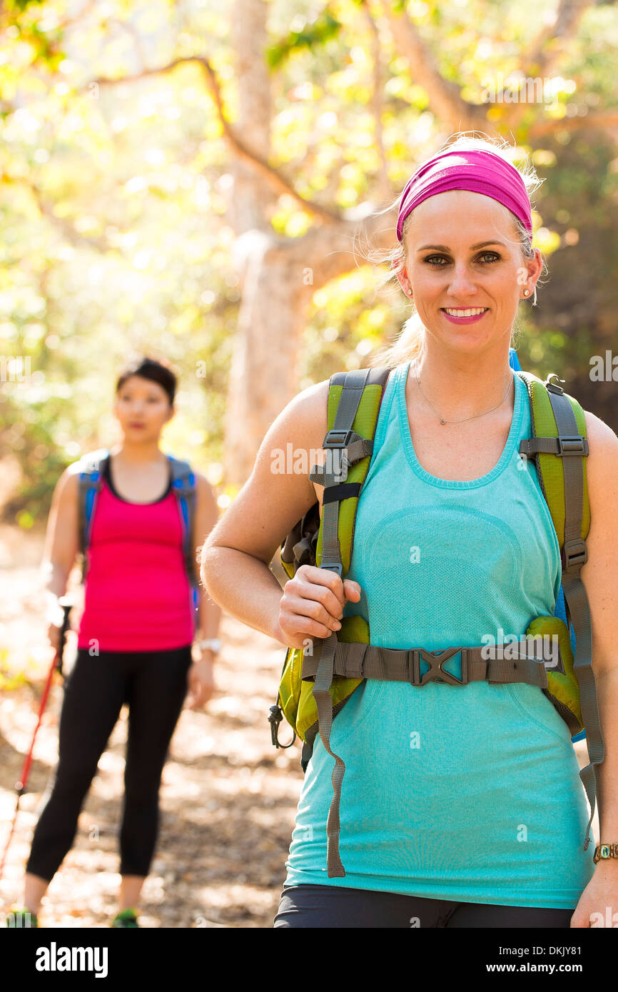 Female hikers standing on trail Stock Photo - Alamy