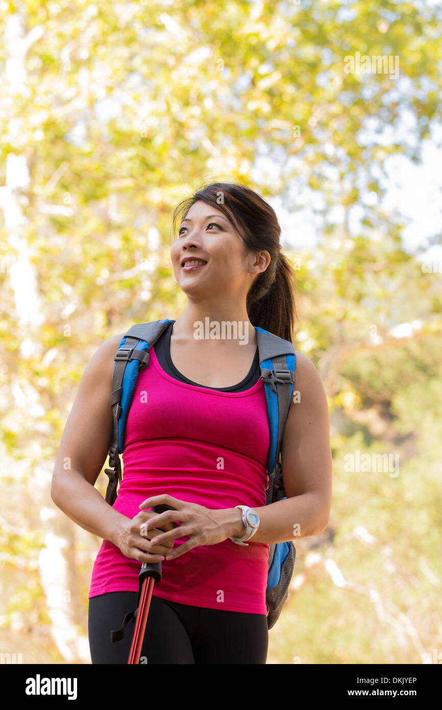 Female hiker looking towards sky Stock Photo - Alamy
