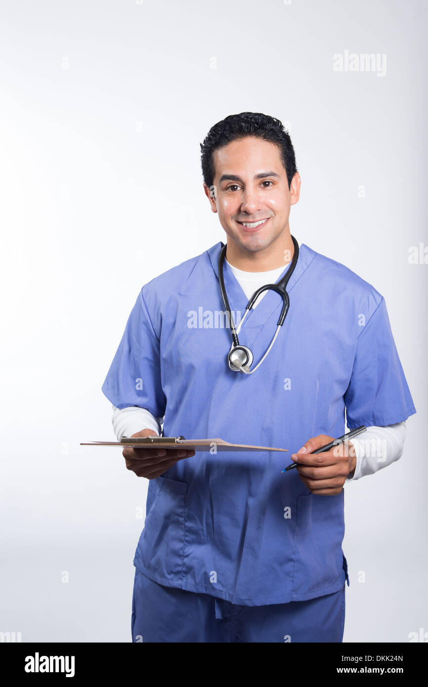 Smiling male nurse holding clipboard Stock Photo - Alamy