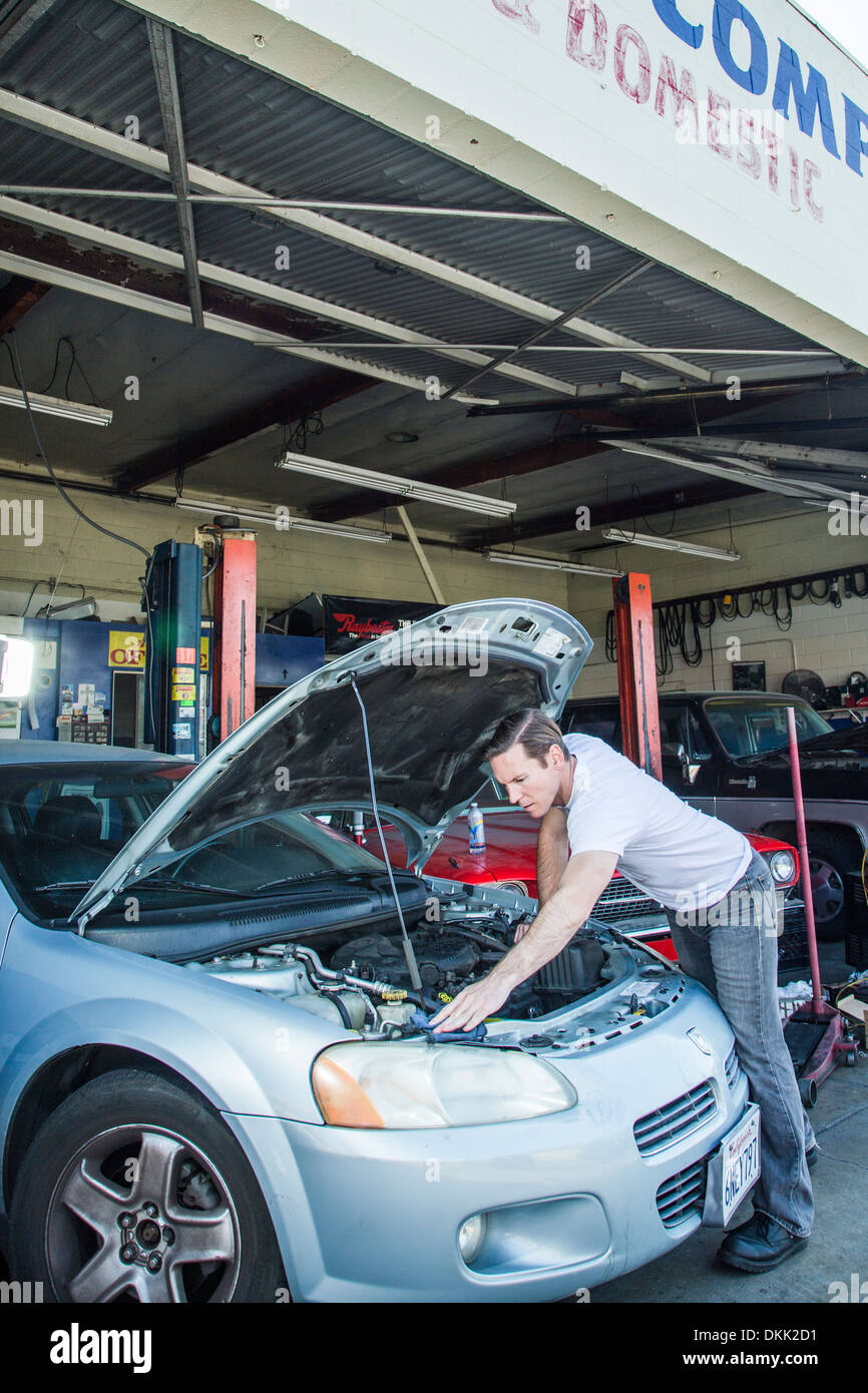 Mechanic working inside vehicle hi-res stock photography and images - Alamy