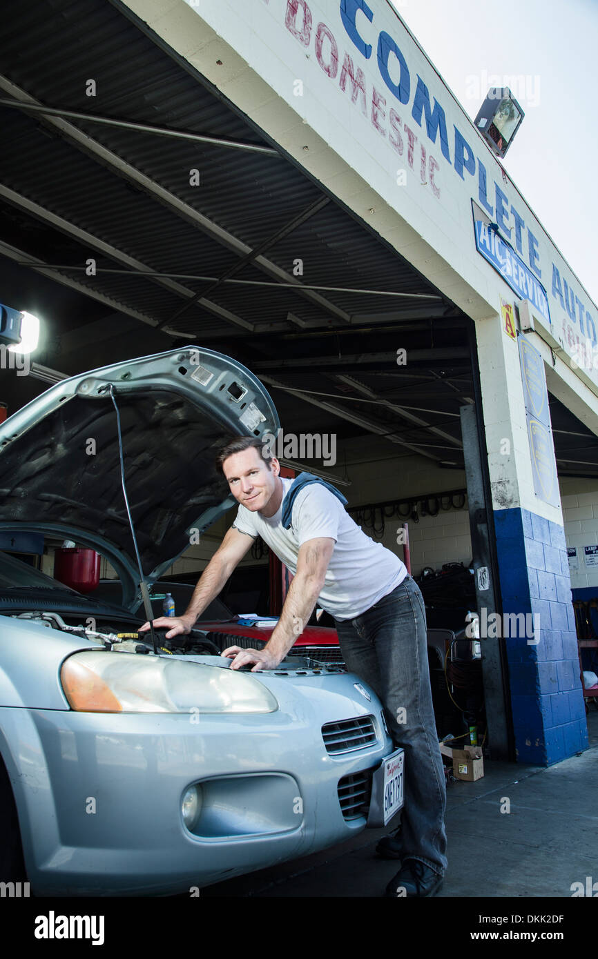 Mechanic leaning on car hi-res stock photography and images - Alamy