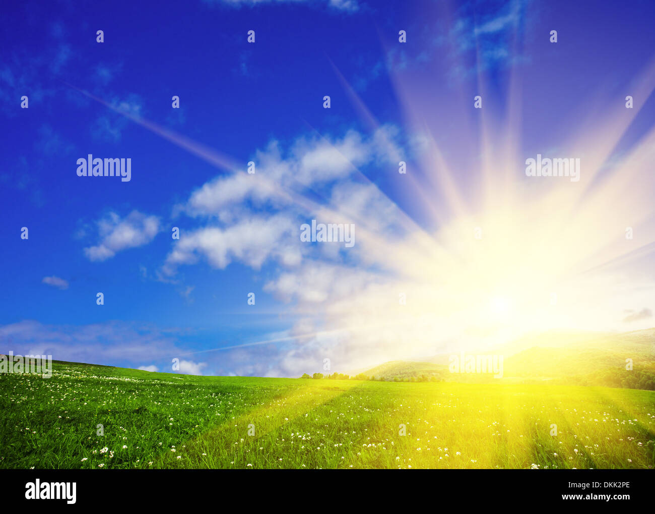 Green meadows and blue sky with sunshine. Nature background Stock Photo ...