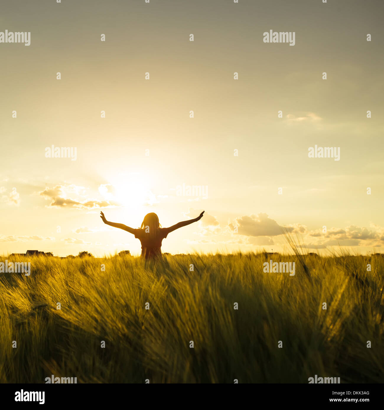 Teenage girl enjoy with sun in the evening glow Stock Photo - Alamy